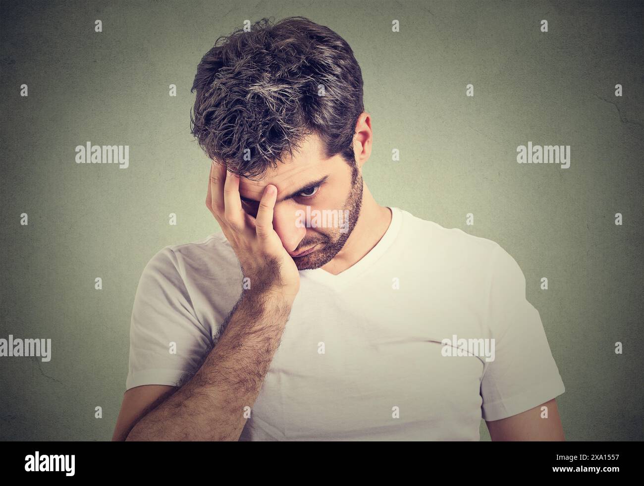 Portrait of a gloomy depressed man looking down Stock Photo - Alamy