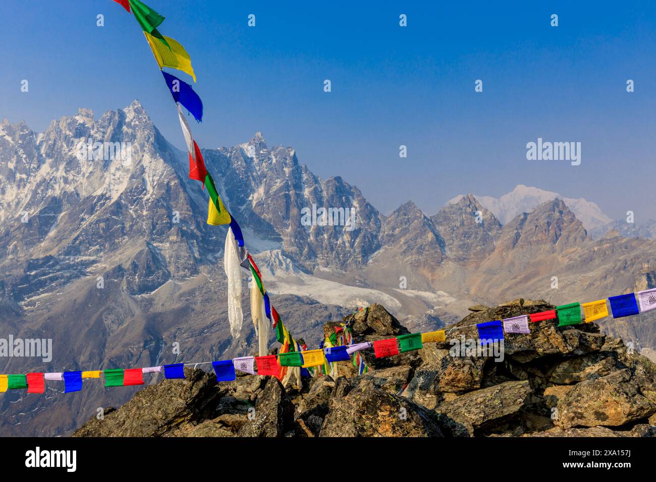 Colorful Nepali and Tibetan prayer flags fluttering in the majestic ...