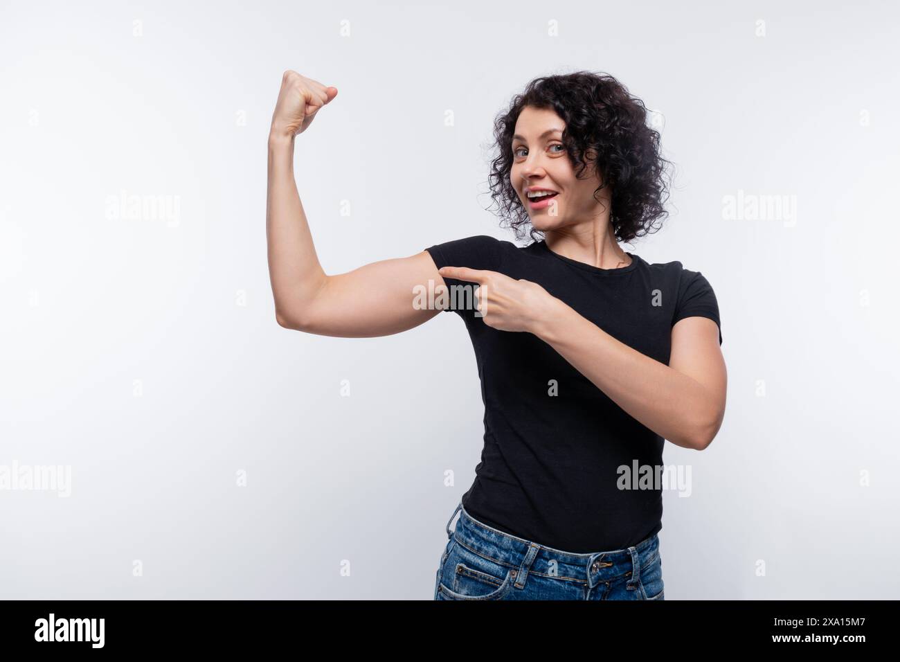 Strong woman shows muscles hi-res stock photography and images - Alamy