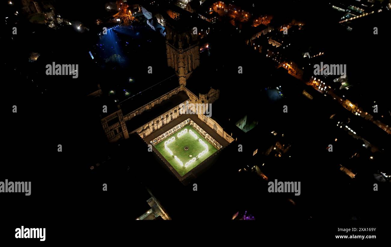An aerial view of city lights with one illuminated building Stock Photo ...
