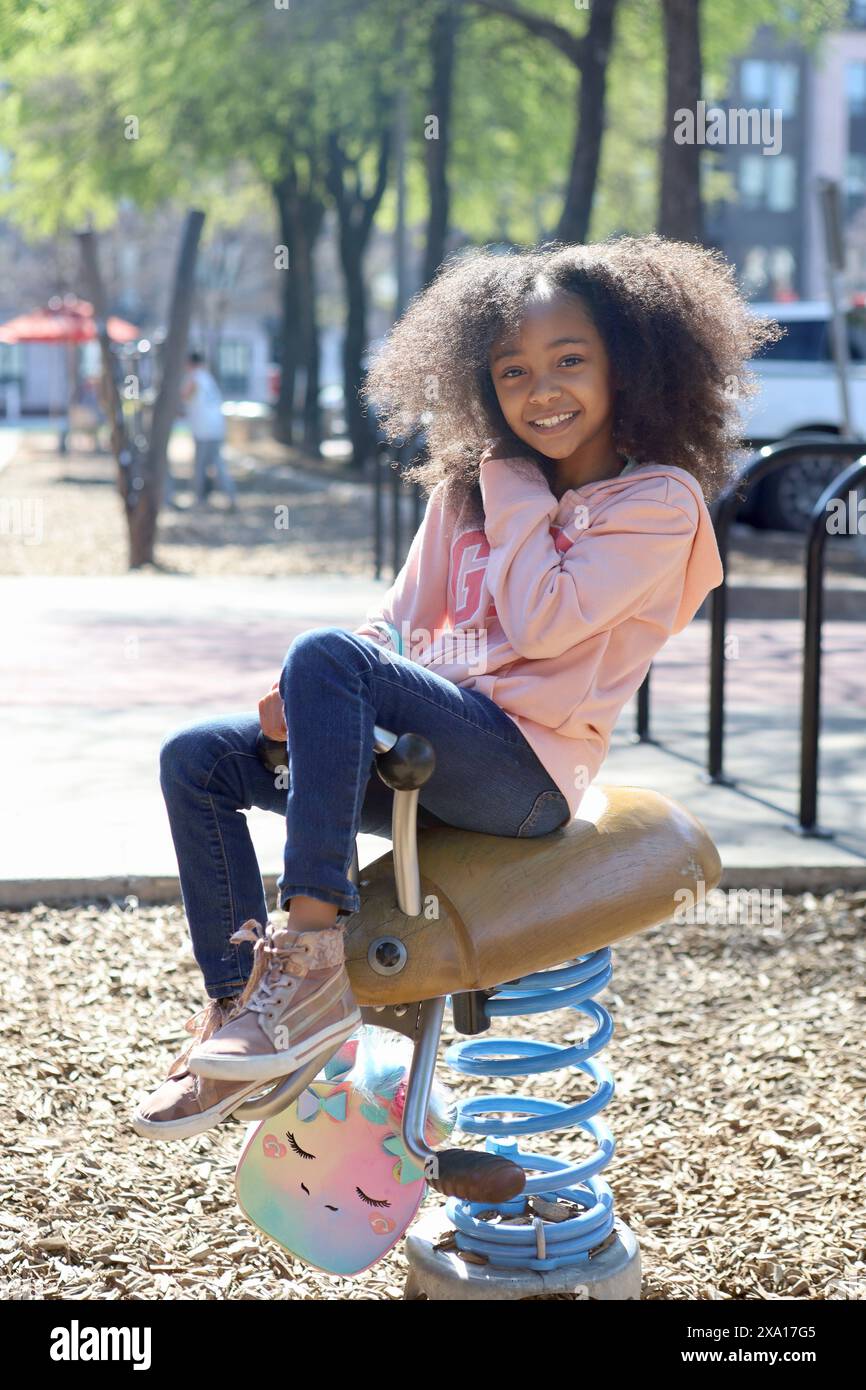 A Pretty Young black girl posing at the playground Stock Photo - Alamy