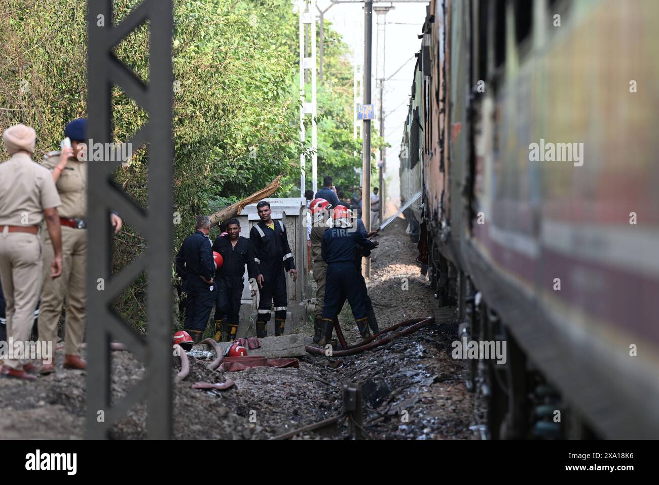 NEW DELHI, INDIA - JUNE 3: Firefighters and passengers on tracks after ...