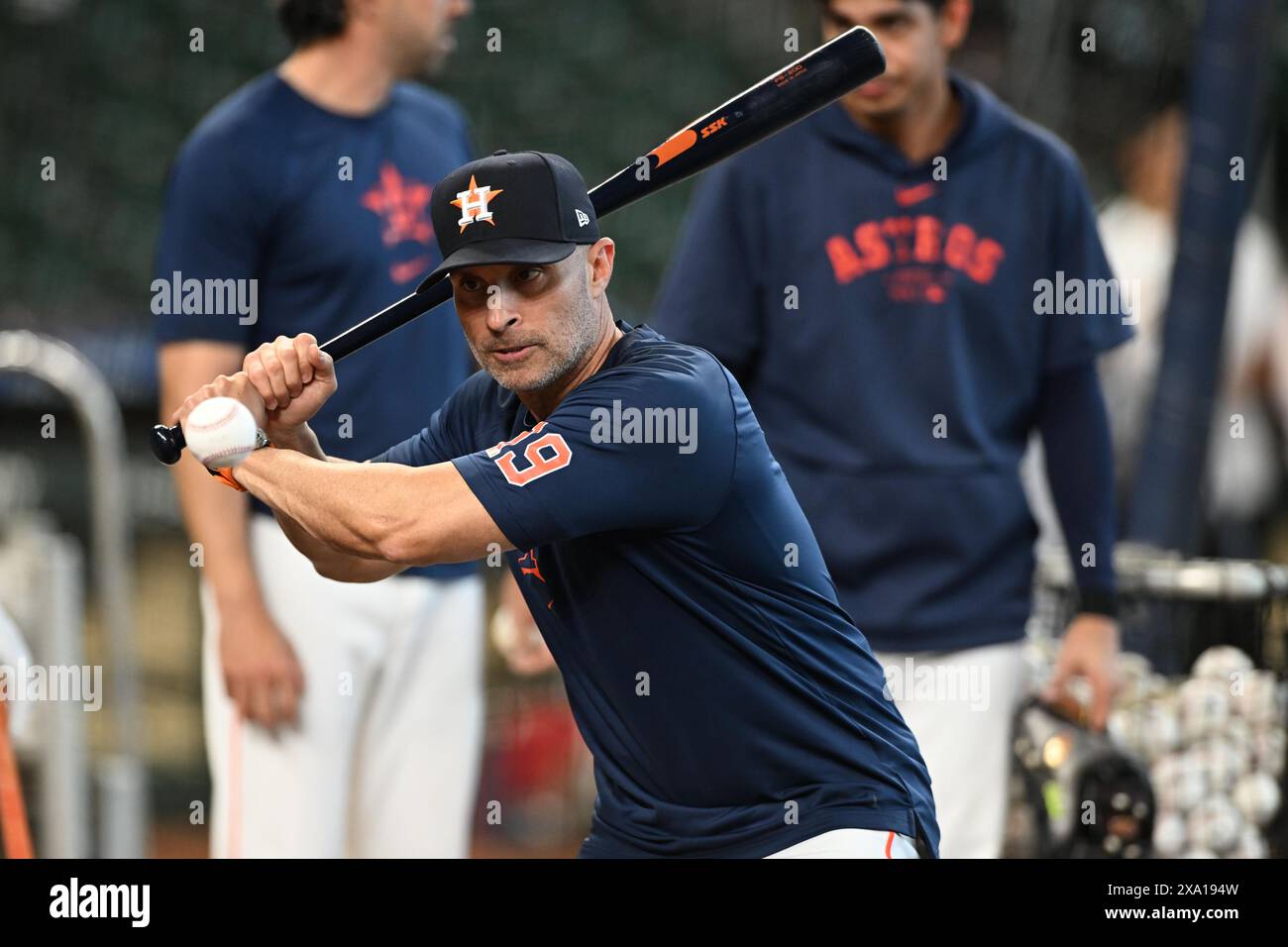 Houston Astros manager Joe Espada (19) hits infield practice before the ...