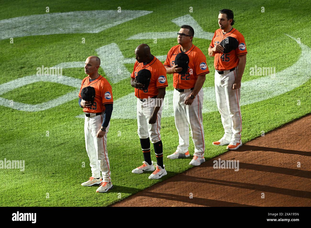 Houston Astros manager Joe Espada (19) and staff honor the National ...
