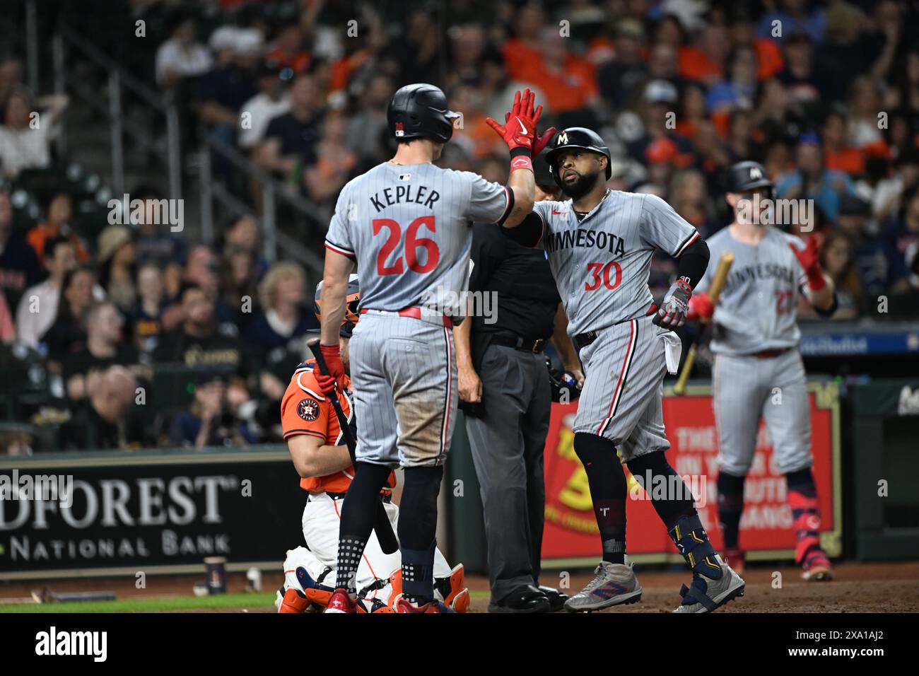 Minnesota Twins first base Carlos Santana (30) celebrates his solo home ...