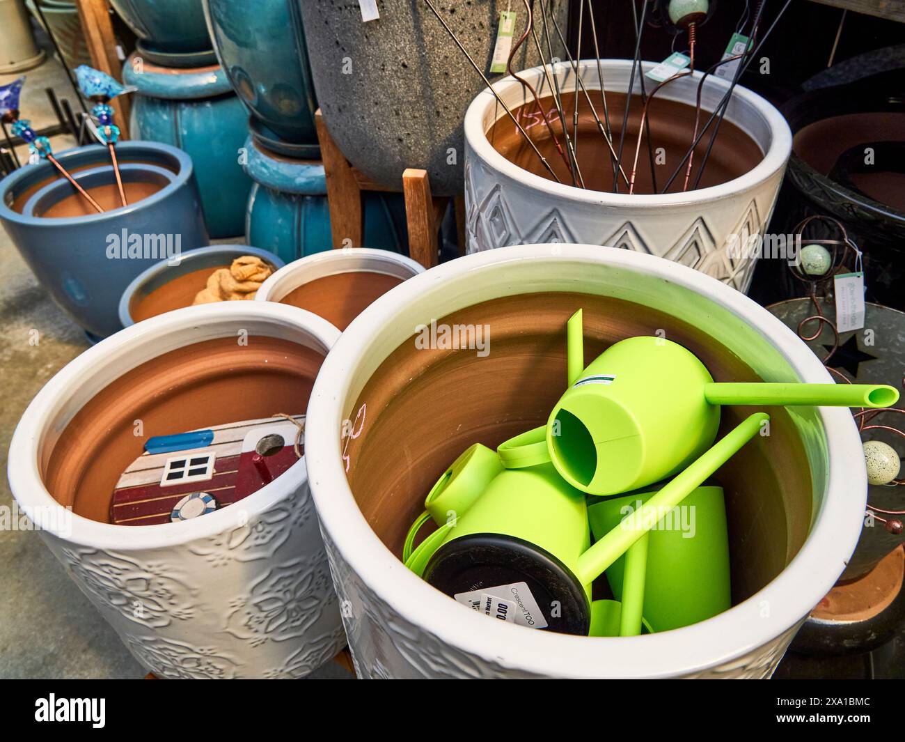 Garden supplies for sale, lime green watering cans, large and small ...