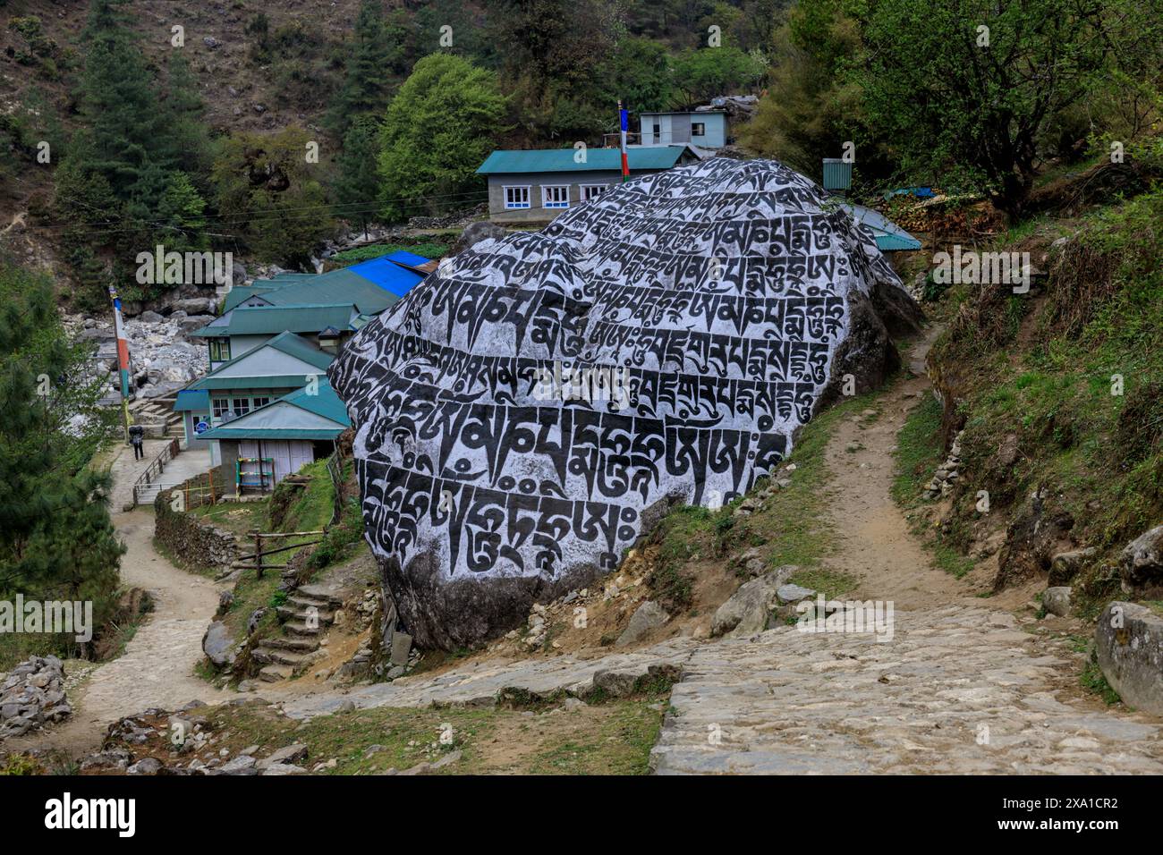 Nepal sacred stones mani with mantra written and carved on the surface ...