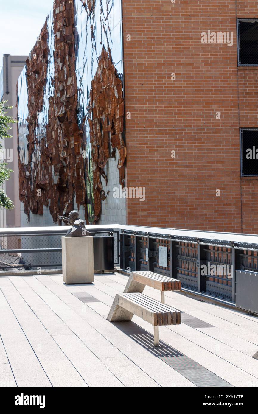 A bench and artwork at the Highline elevated park in New York City ...