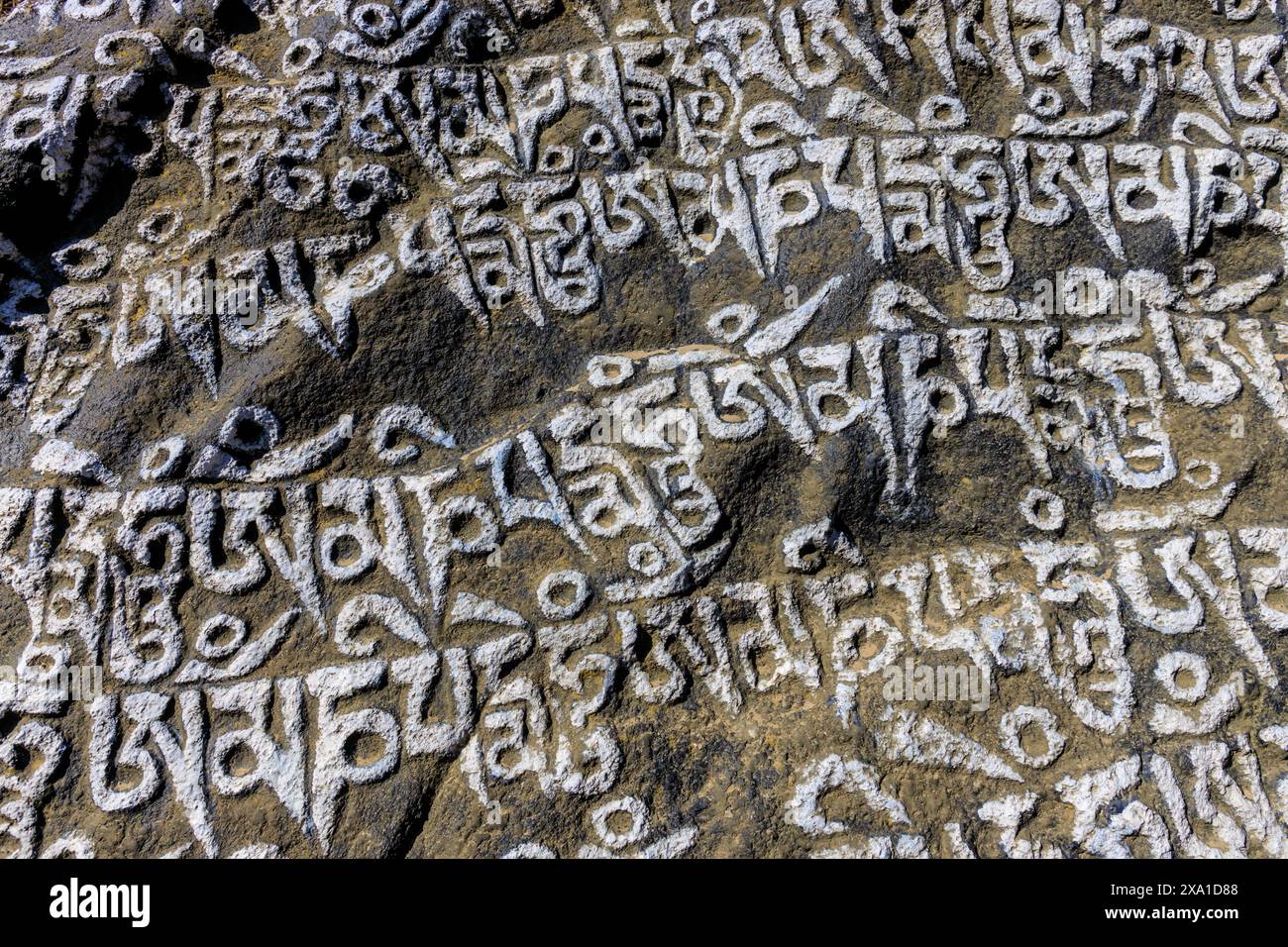 Nepal sacred stones mani with mantra written and carved on the surface ...