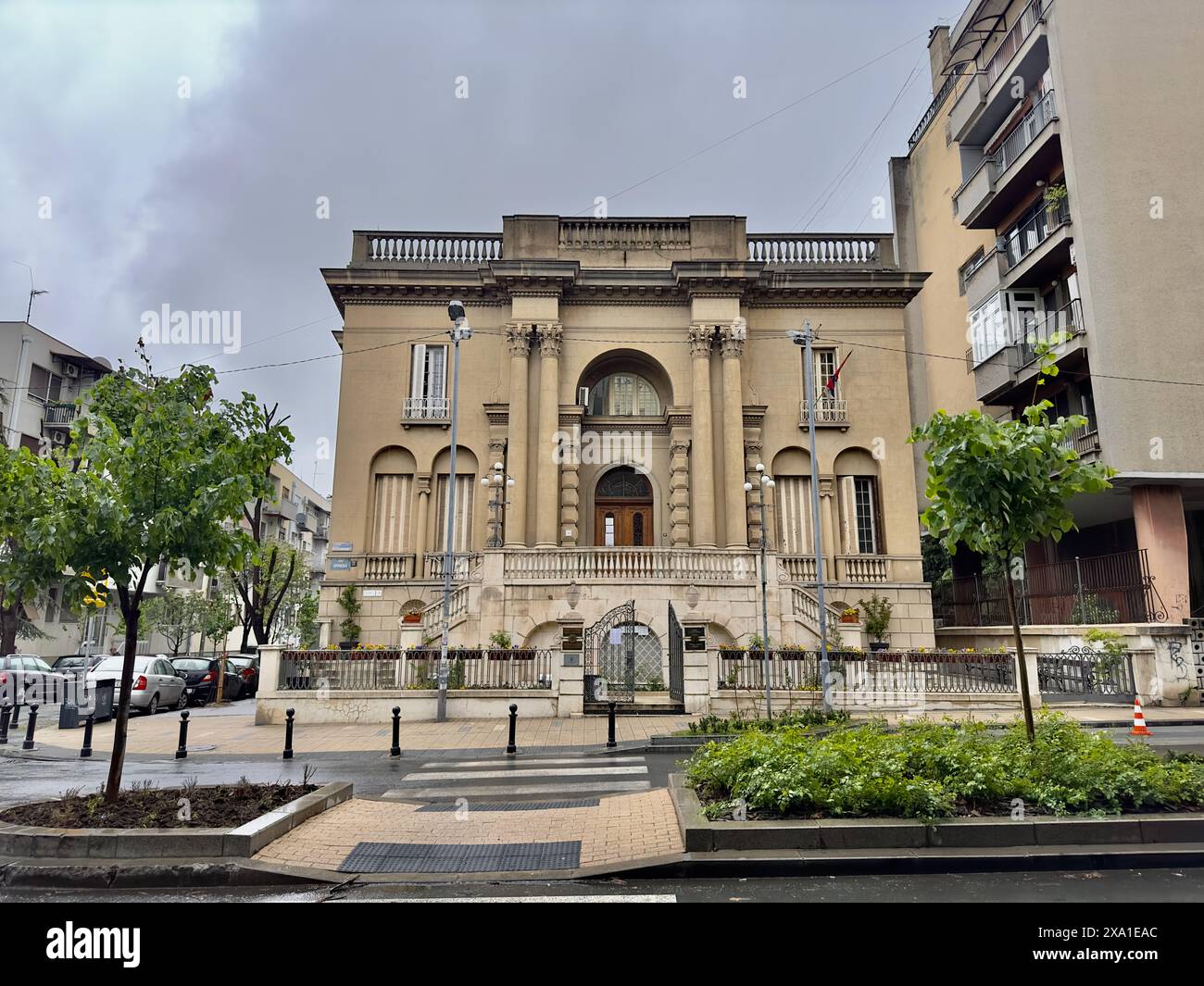 A tall building stands in the heart of a bustling city street in Nikola ...