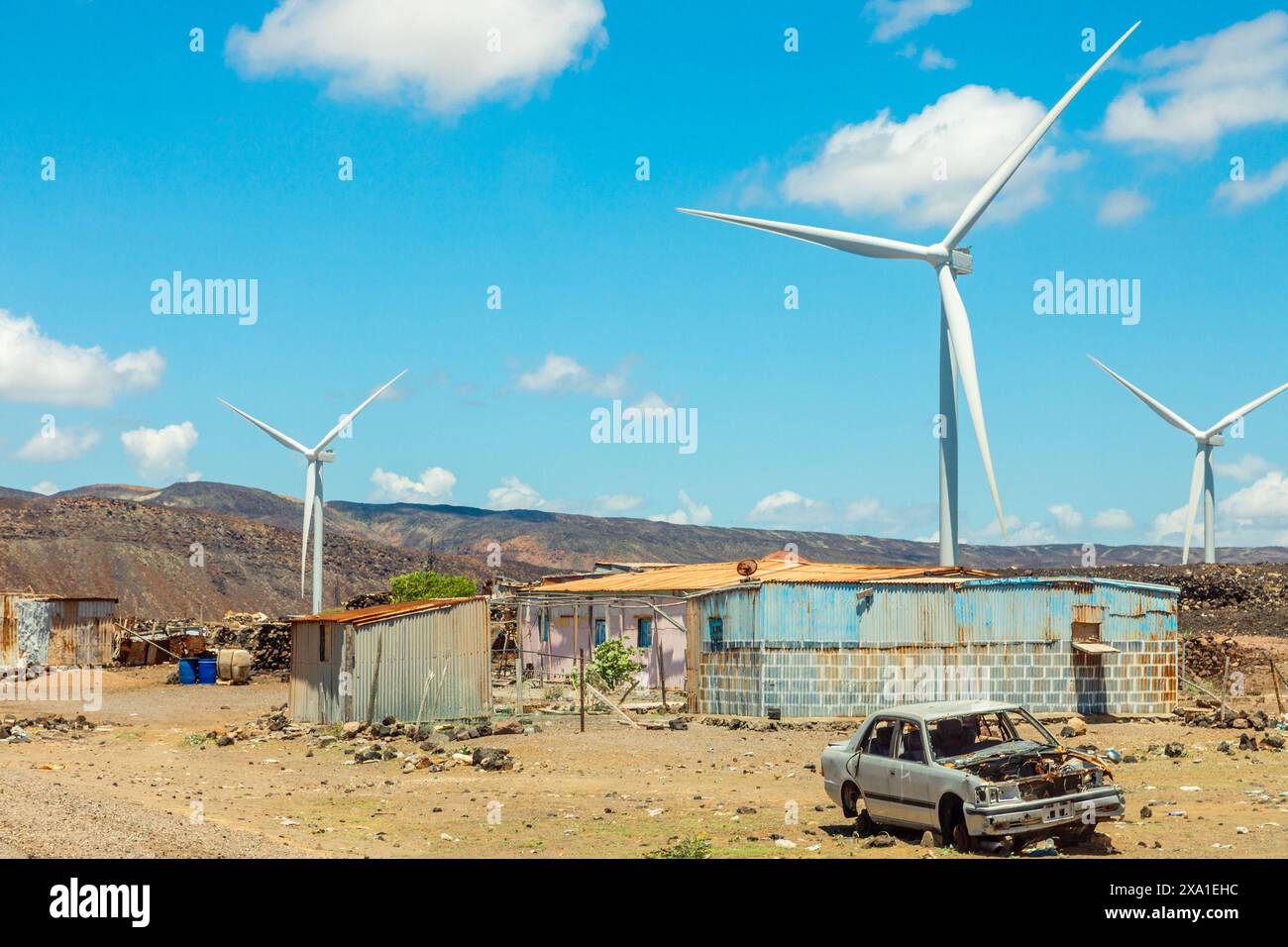 Wind power turbines generators of grid station farms standing behind ...