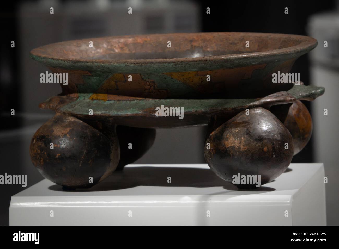 Wooden bowl on two metal balls and oval object Stock Photo - Alamy