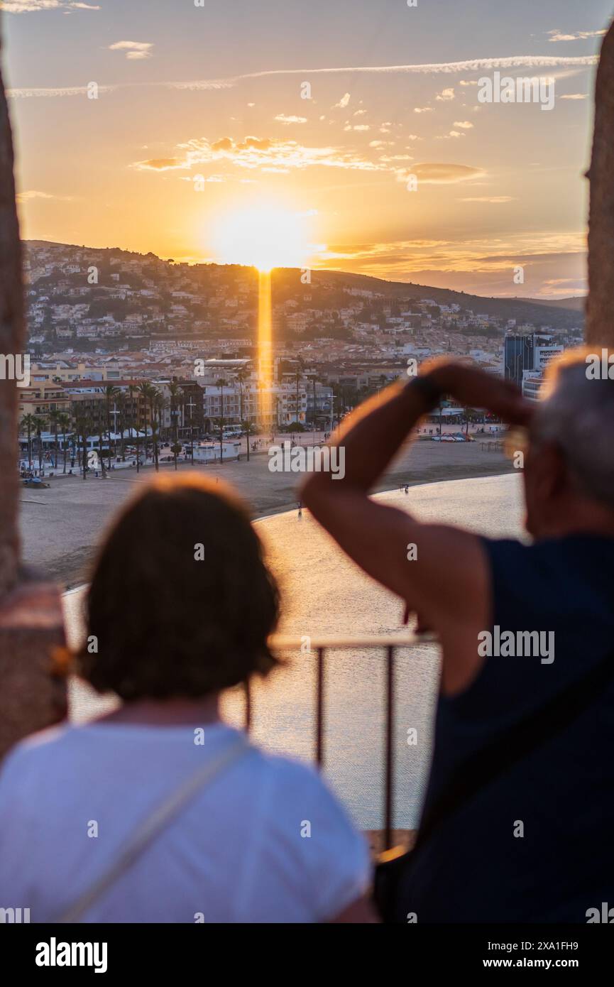 Couple enjoying the sunset view from from the city walls of the Papa ...