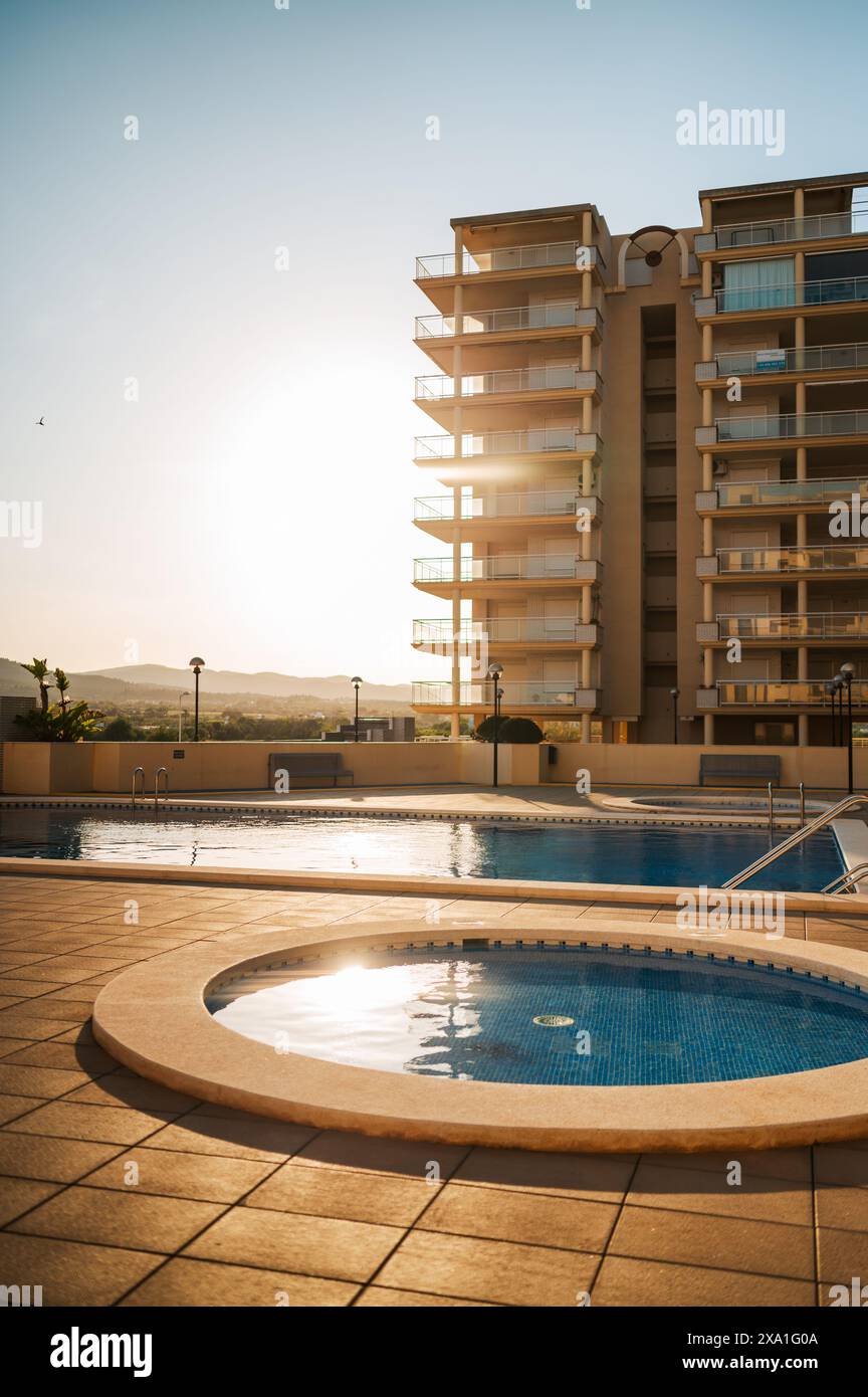 Pool in a private condominium in Peñiscola at sunset, Castellon ...