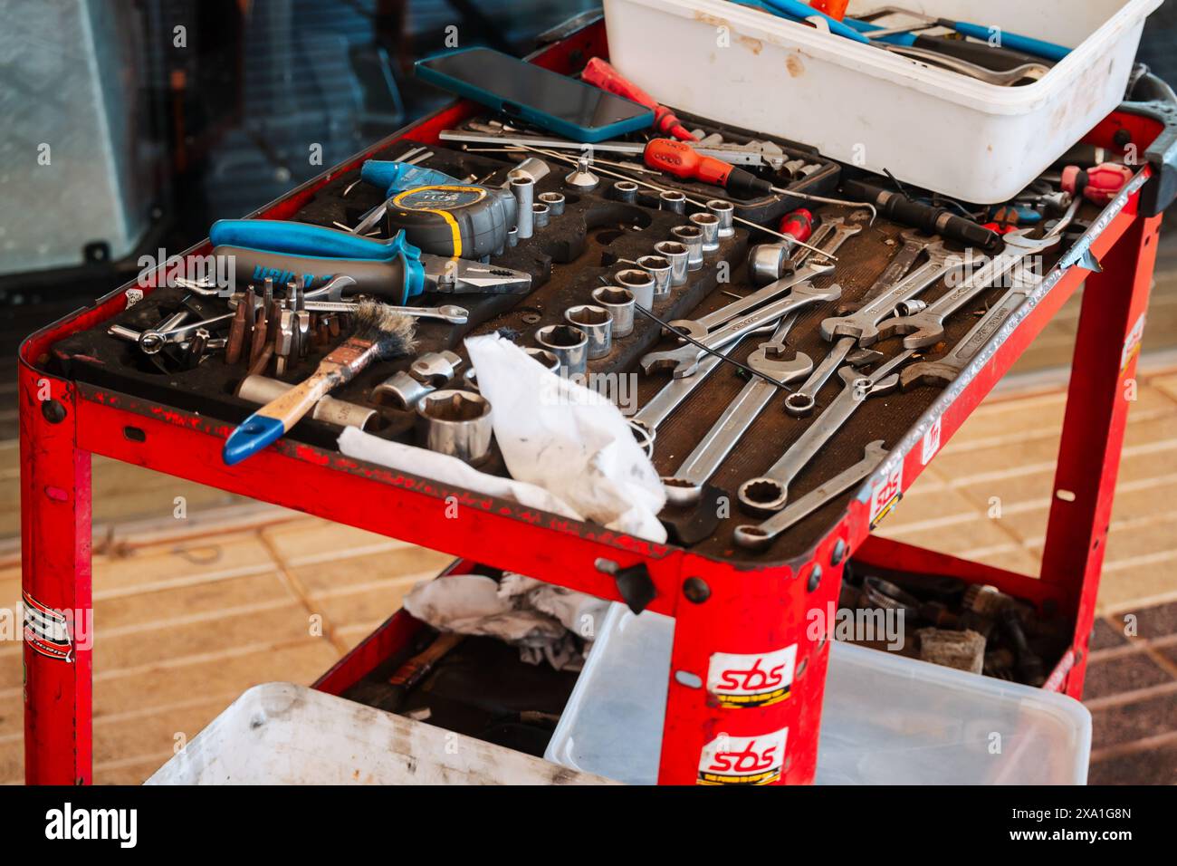 Tool table in bike shop Stock Photo - Alamy