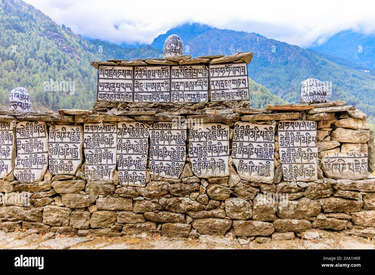 Nepal sacred stones mani with mantra written and carved on the surface ...