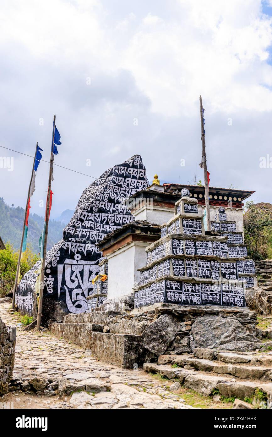 Nepal sacred stones mani with mantra written and carved on the surface ...