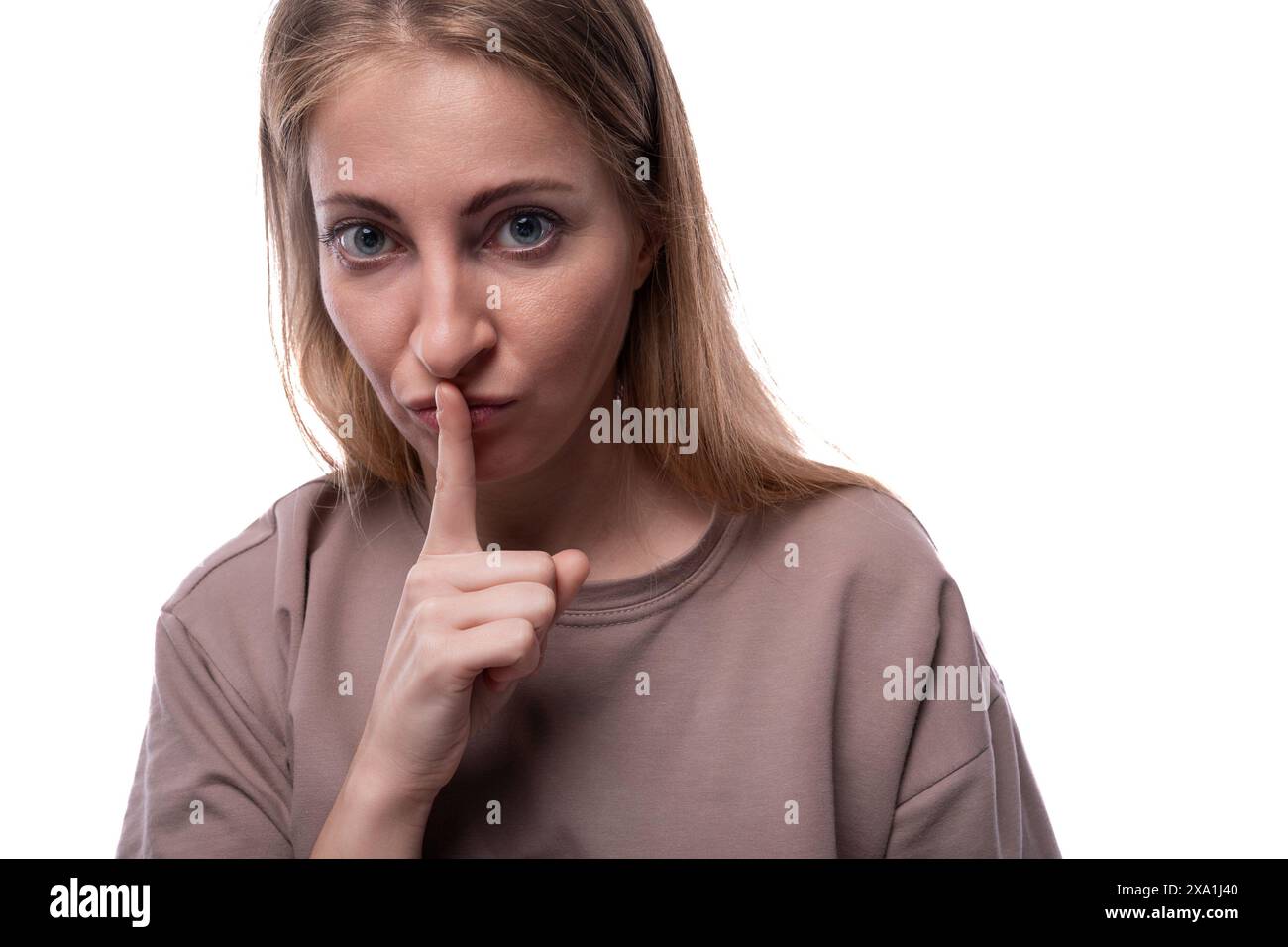Blonde adult woman keeping a secret Stock Photo - Alamy