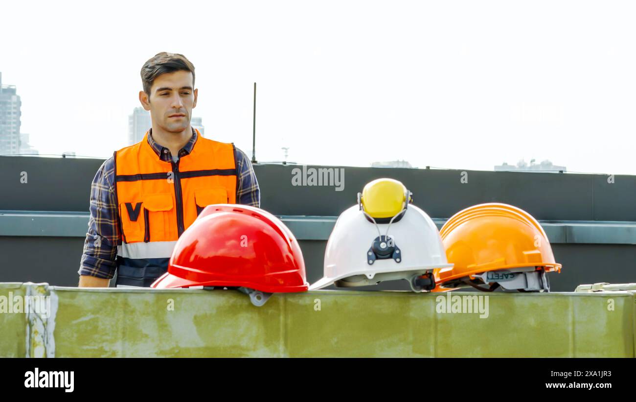 Engineer wearing hard hat observing hi-res stock photography and images ...