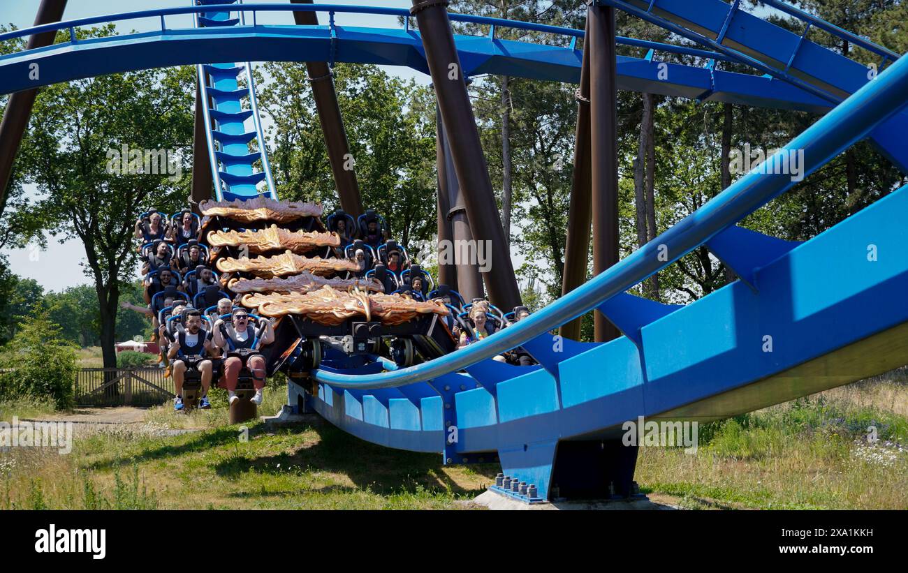 Young people are screaming on the Fenix wing roller coaster at the ...