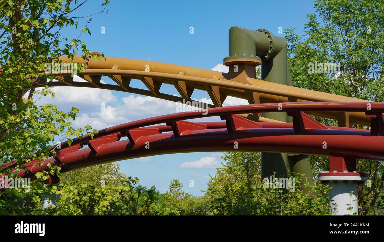 Yellow and red-coloured roller coaster tracks of coasters in Tripsdrill ...