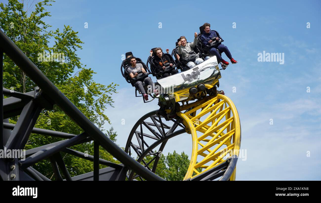 Young people have fun on the "Lost Gravity" rollercoaster at the "Walibi-Holland" amusement park ...