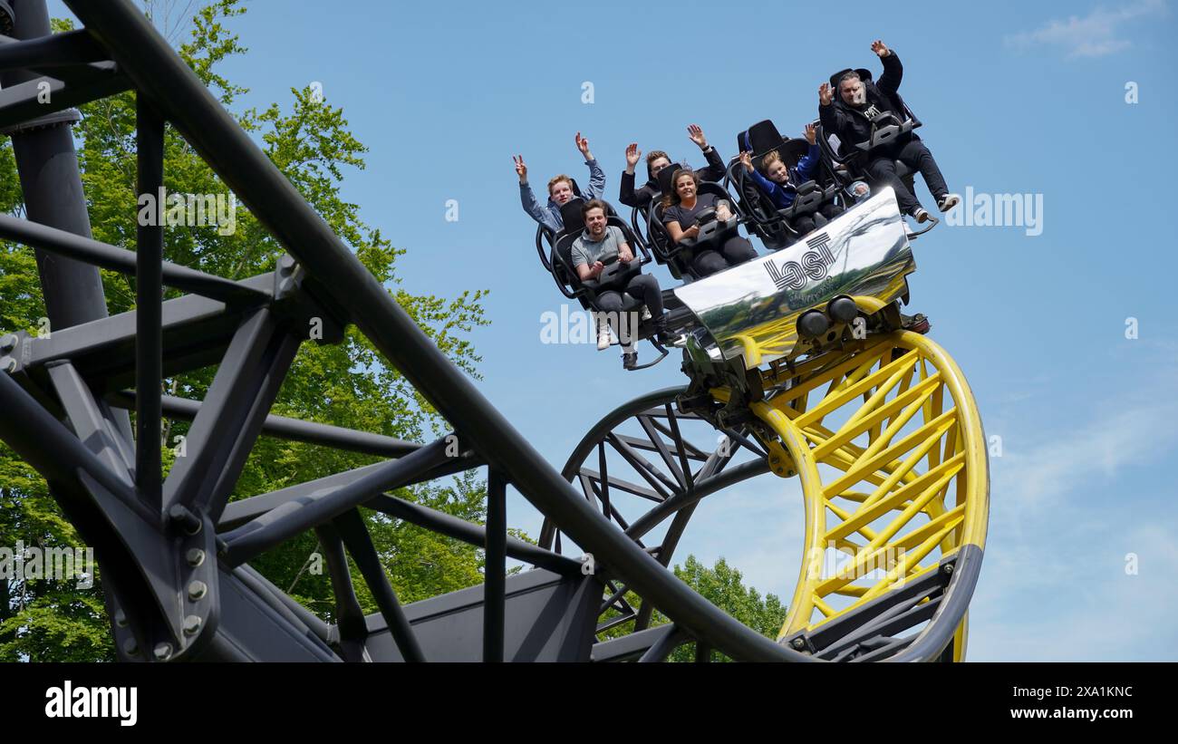 Young people have fun on the "Lost Gravity" rollercoaster at the ...