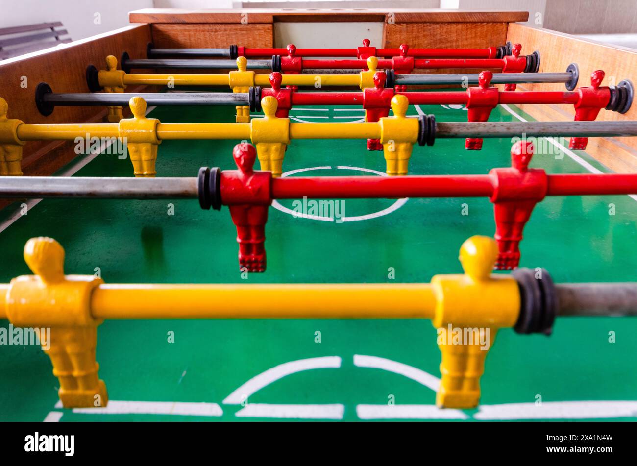 Indoor soccer game with foosball table, balls, and sticks Stock Photo ...
