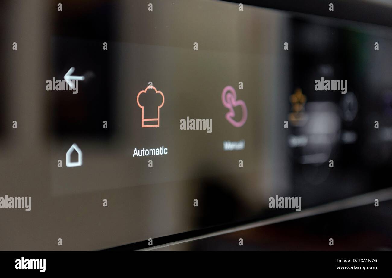 Close-up photo of icons on touch screen controls on modern oven in ...