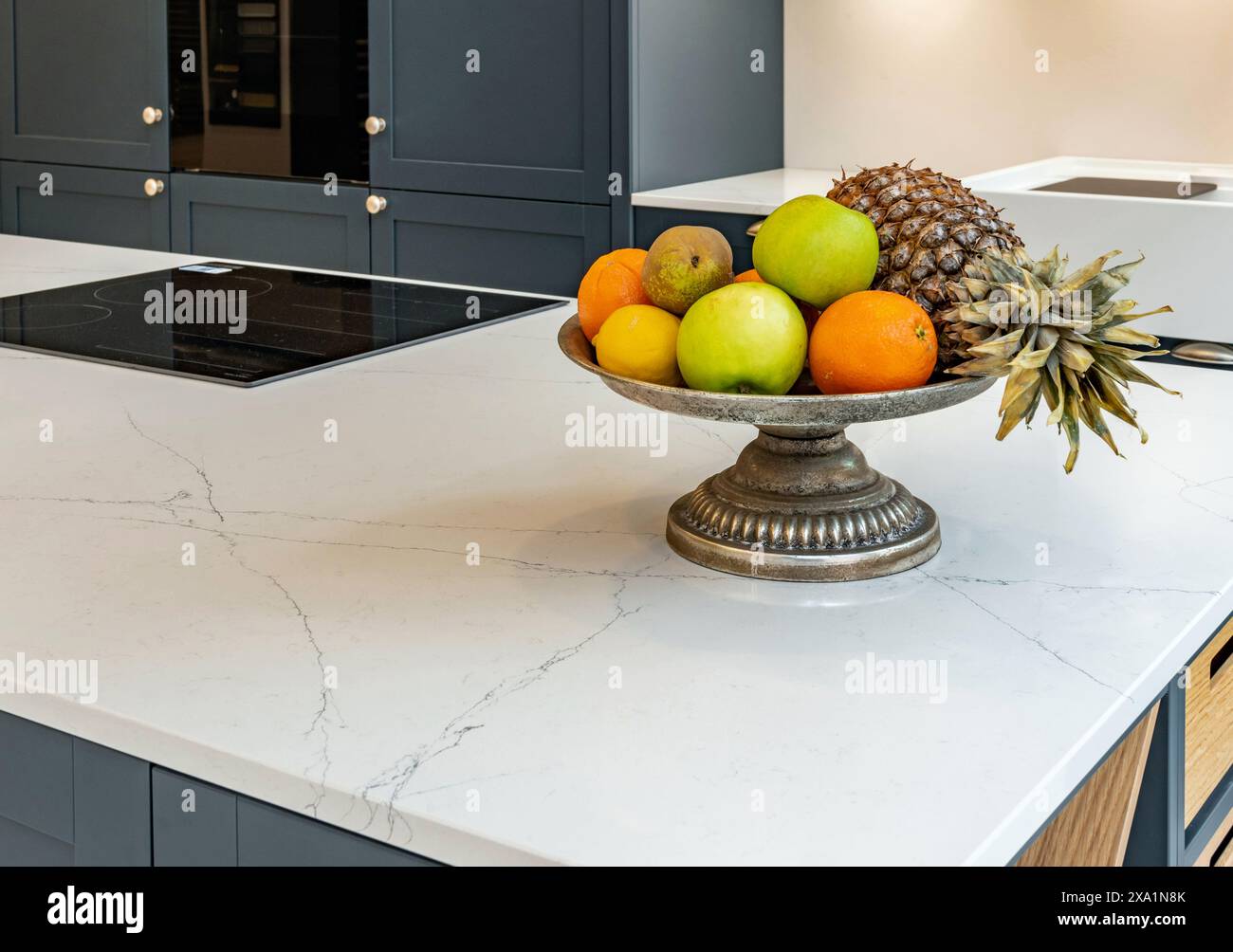 Decorations and fruit on countertop in modern, chic kitchen in a ...