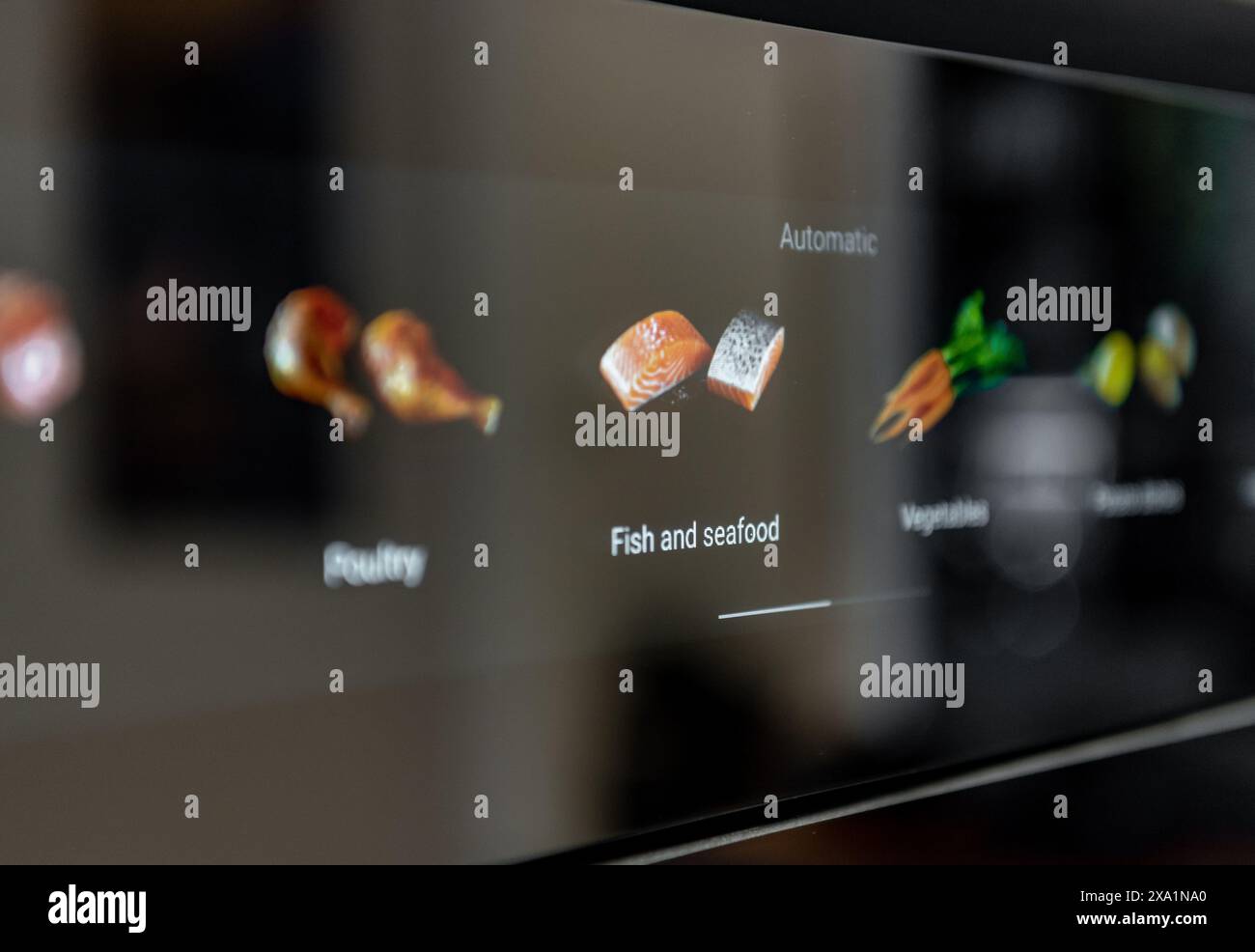 Close-up photo of icons on touch screen controls on modern oven in ...