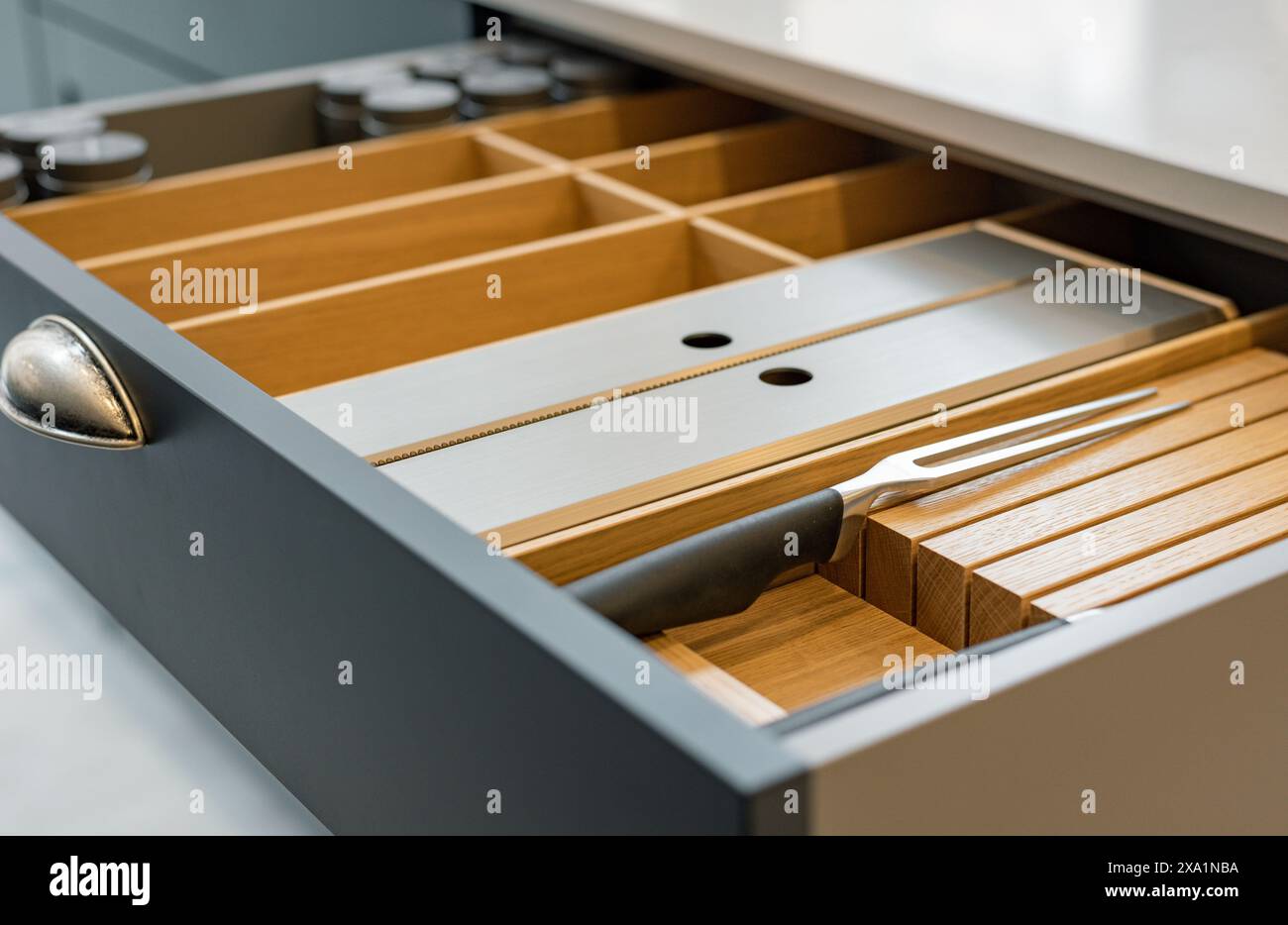 Close-up shot of dividers in modern kitchen drawer Stock Photo - Alamy