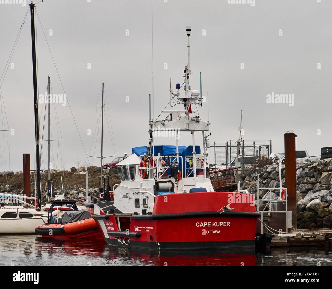 View of the stern of the bright red and white coast guard vessel the ...