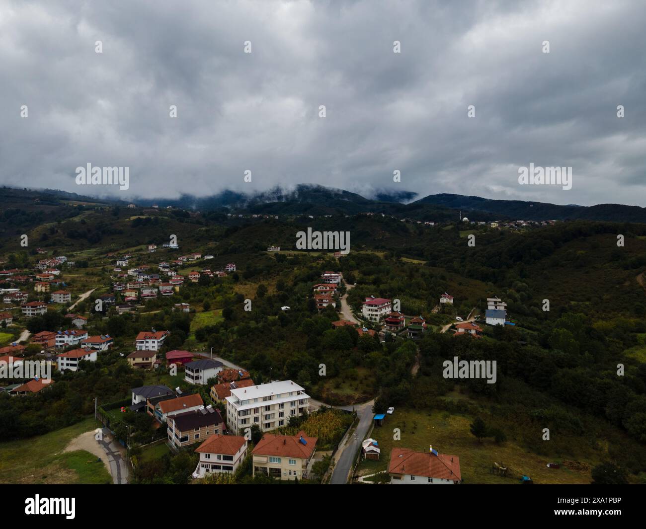 An aerial view of the cloudy sky above the mountains and town. Bolu ...