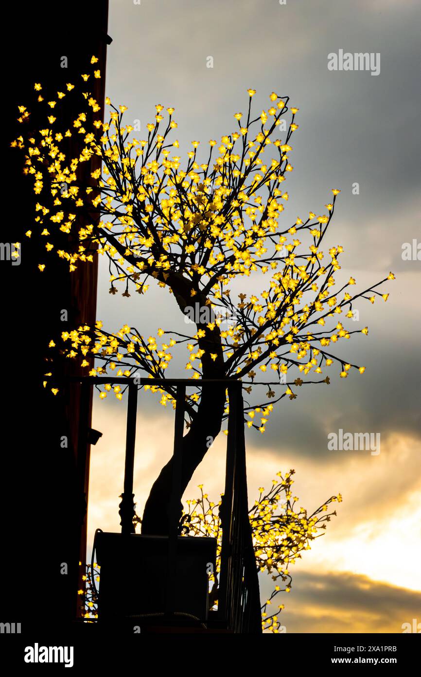 Artificial led tree on a sunset sky Stock Photo - Alamy