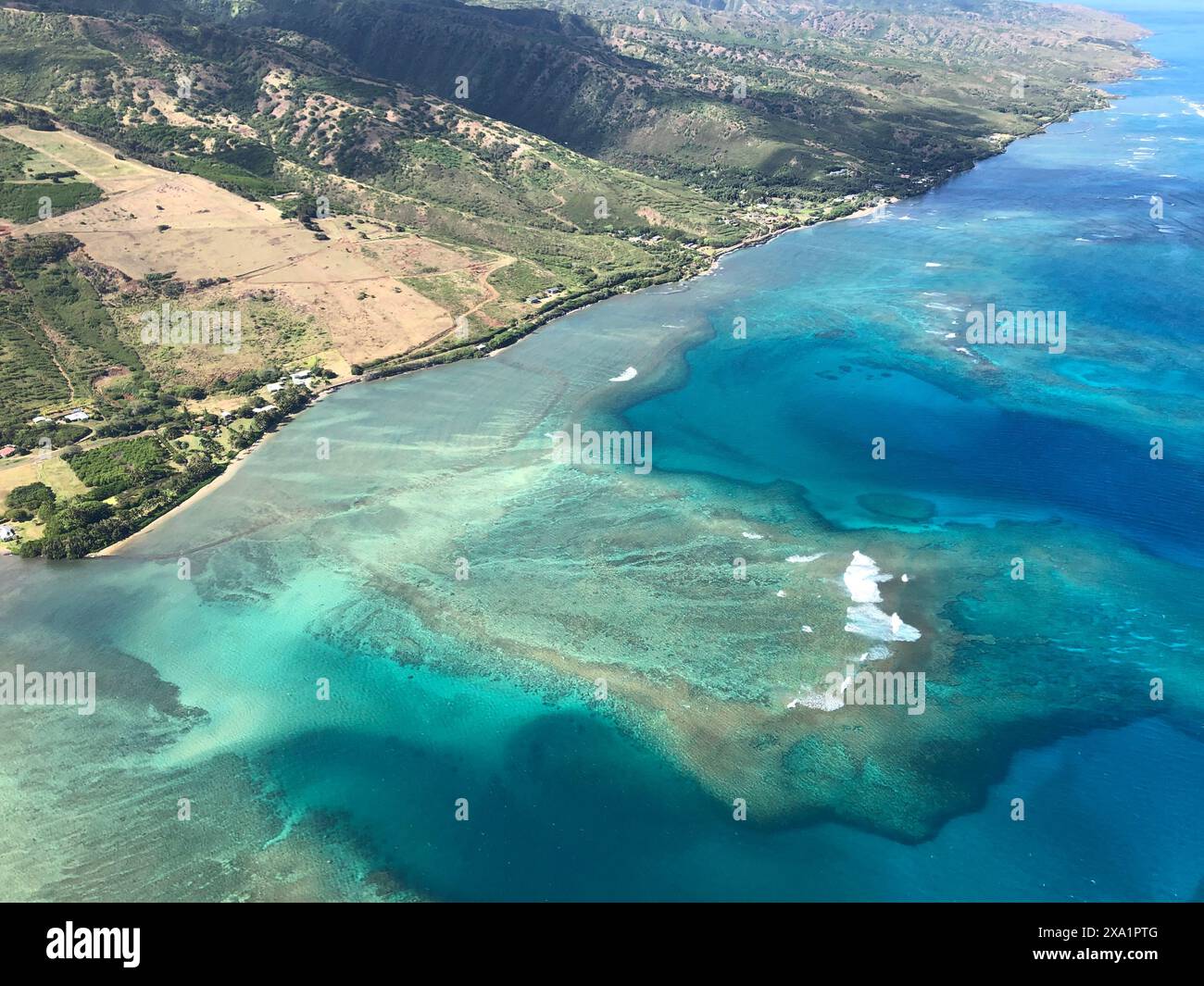 An aerial view of stunning blue lagoon with island and ocean Stock ...