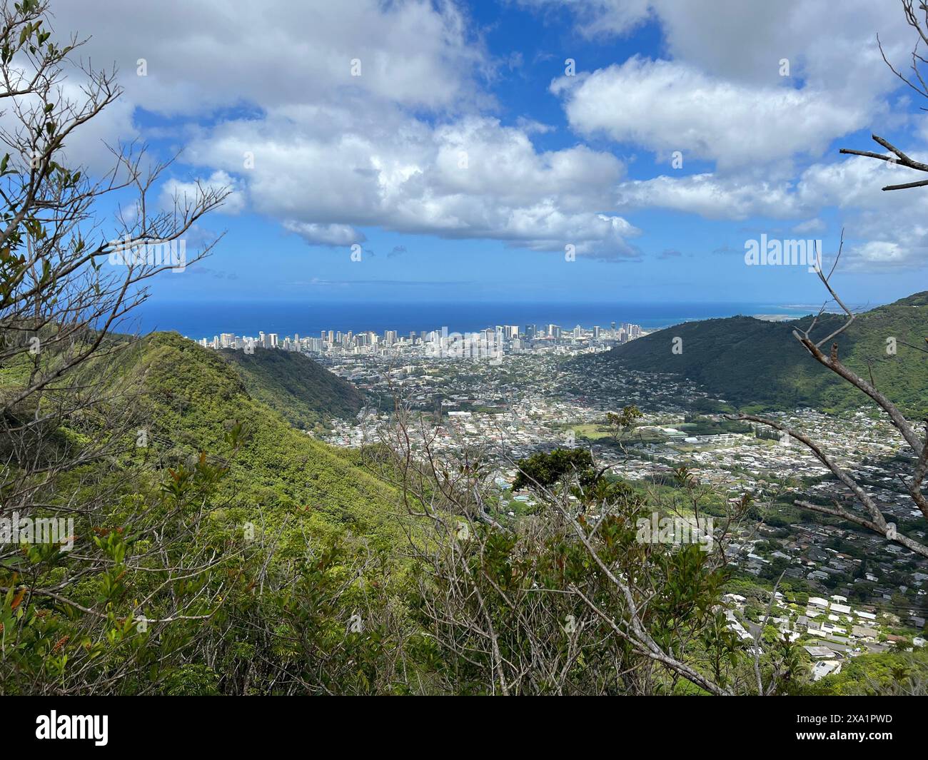 An aerial view of a town nestled in verdant hills landscape Stock Photo ...