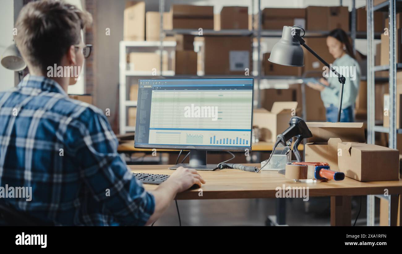 Young Man Using Desktop Computer with a Dashboard and Orders ...