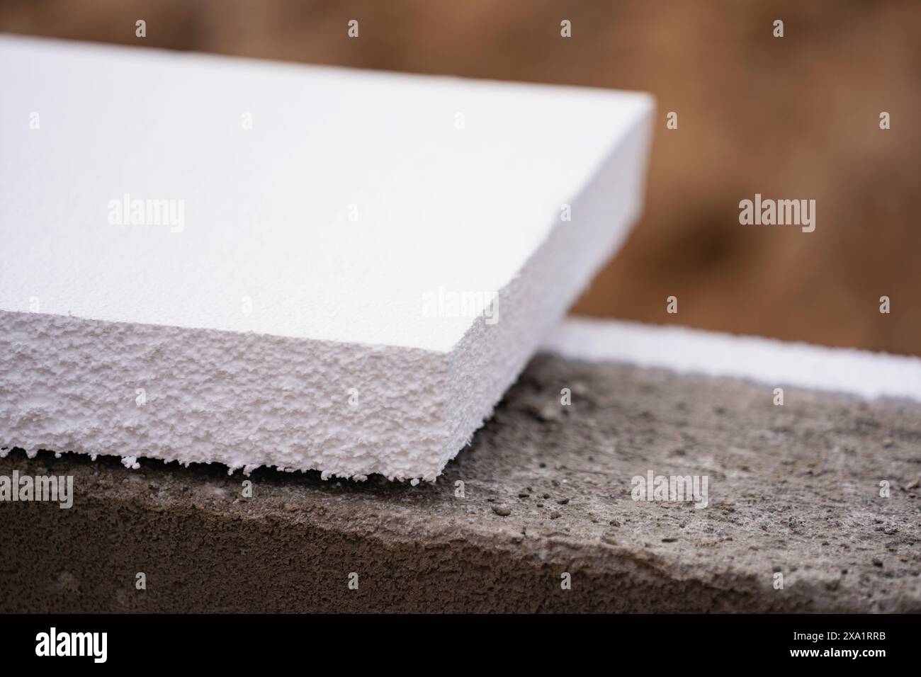 A close-up of a concrete wall with polyfoams at an industrial ...