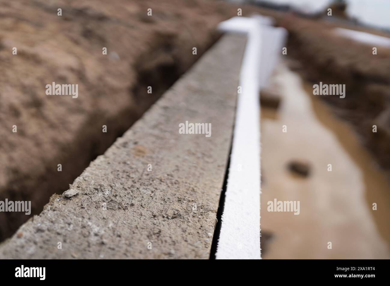 A close-up of a concrete wall with polyfoams at an industrial ...