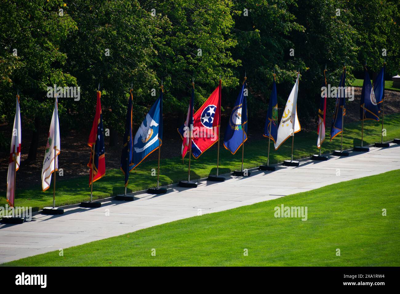 A row of flags from different countries and military branches at ...