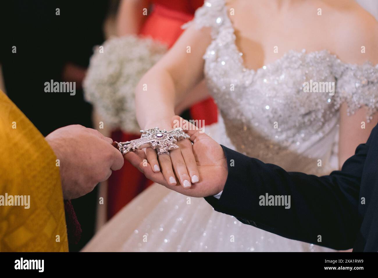 The priest blessing the bride and groom during a traditional Armenian ...
