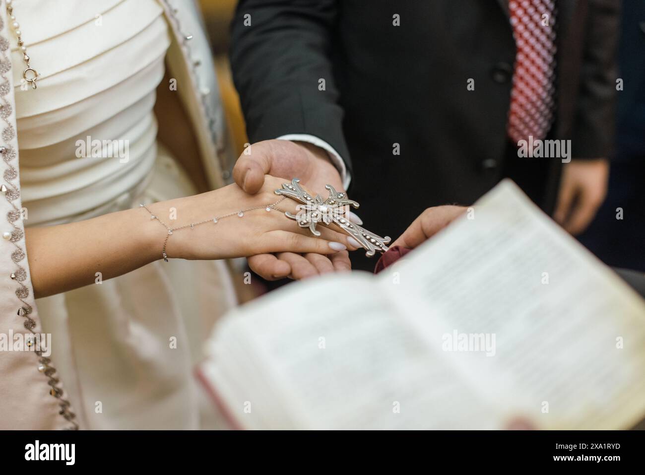 The priest blessing the bride and groom during a traditional Armenian ...