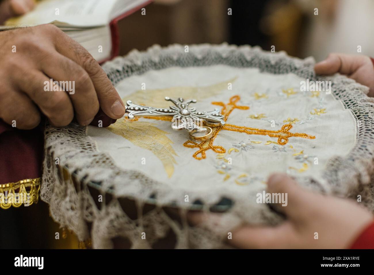The priest blessing wedding rings during a traditional Armenian wedding ...