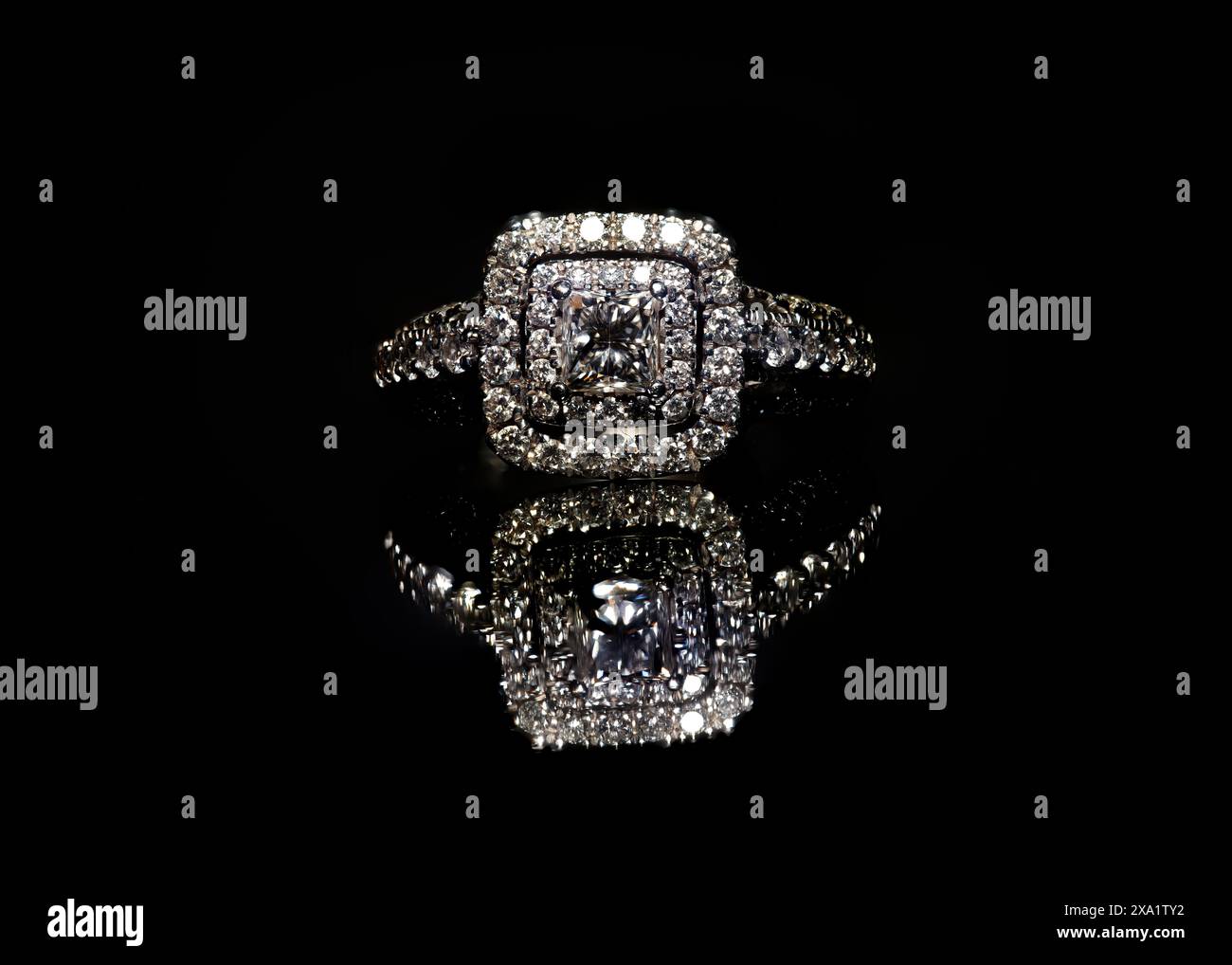 A diamond ring on reflective surface for elegant reflection Stock Photo ...