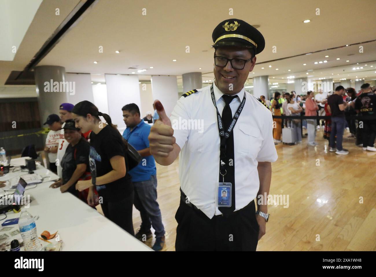 A Mexican pilot show his finger after to cast his vote at a polling ...