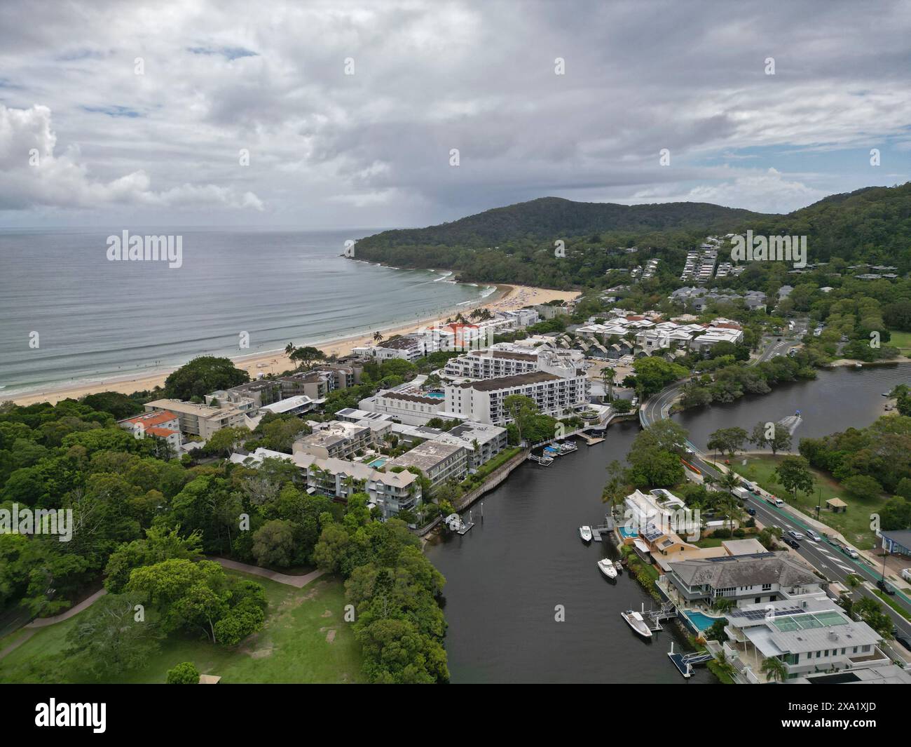Aerial view of beach, buildings, and water from a helicopter in Noosa ...