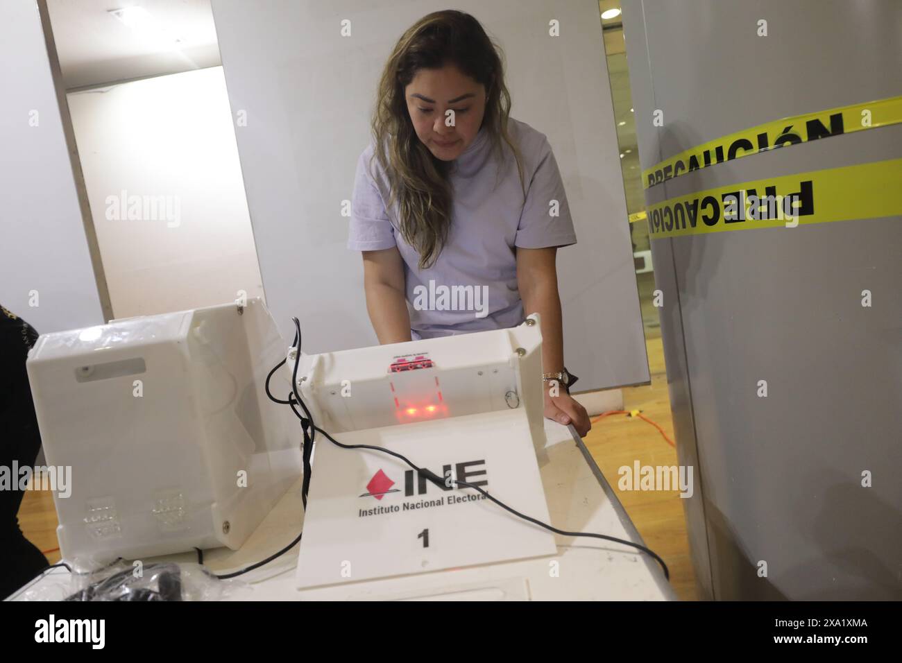 Mexico City, Mexico. 02nd June, 2024. A Mexican citizen casting his ...