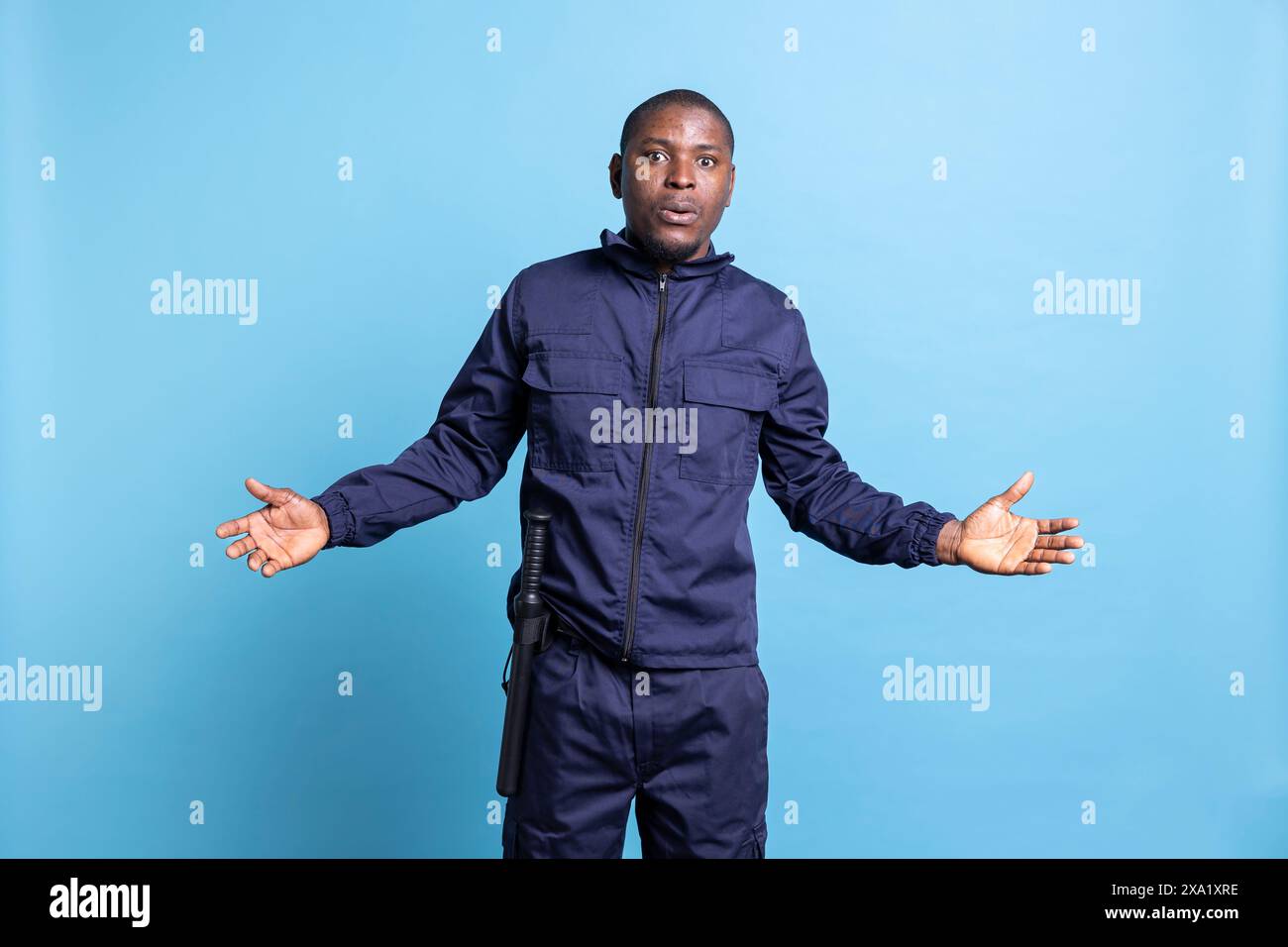 Security guard in uniform is acting surprised in front of the camera ...