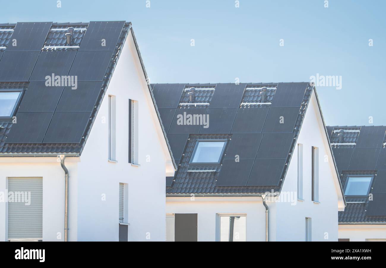 Row of new build houses under the blue sky with the solar roofs Stock ...